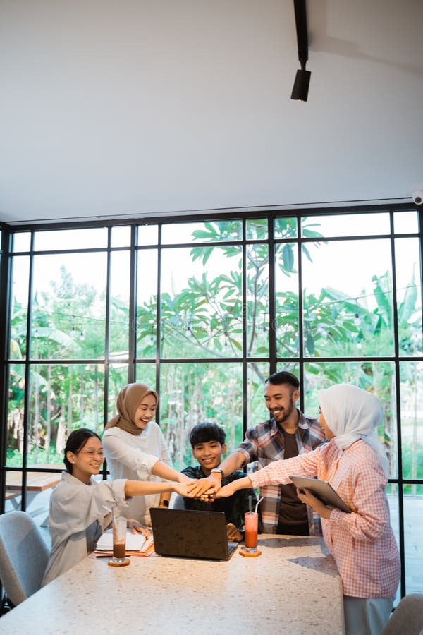 Group of Asian Students with Hand Gesture Symbol of Unity Stock Photo ...