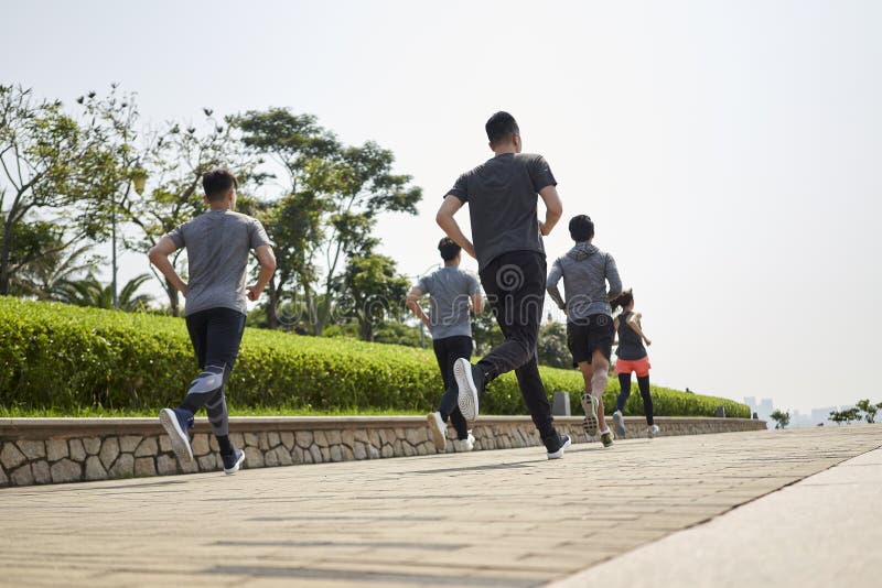 Group Of Asian Young Adults Running Outdoors Stock Photo - Image of ...