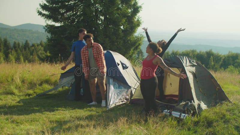 Group of Diverse Multicultural Hikers Waking Up in Morning at Campsite ...