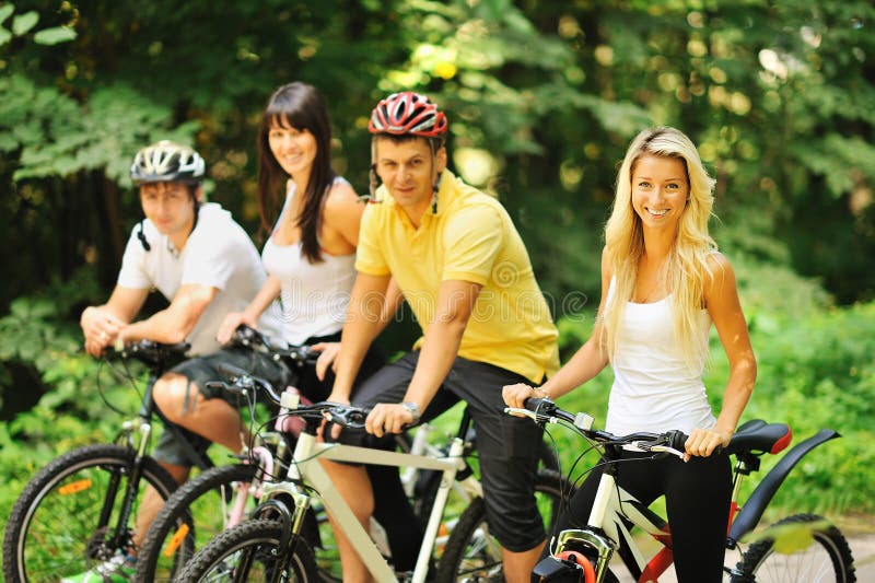 Group Of Attractive Happy People On Bicycles In The Countryside Stock ...