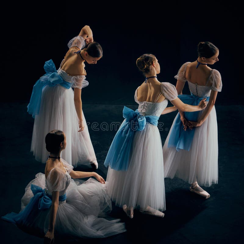 Group of Ballerinas Dressed in Elegant White Tutus with Delicate Blue Sashes, Practicing Their ...