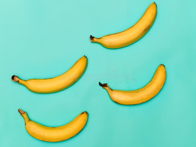 The Group of Bananas Against Blue Background Stock Image - Image of ...