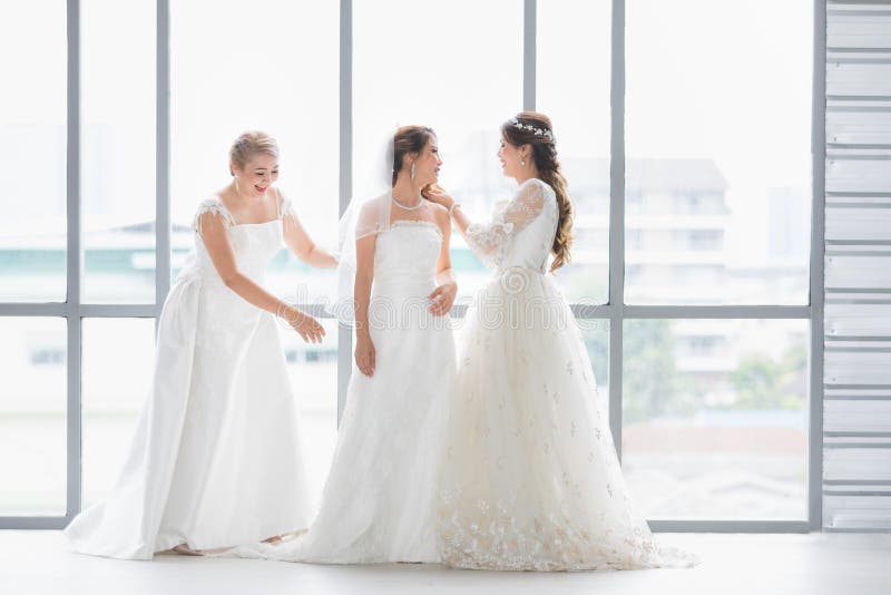 Group of Beautiful Brides Arrange Their Dress Stock Image - Image of ...
