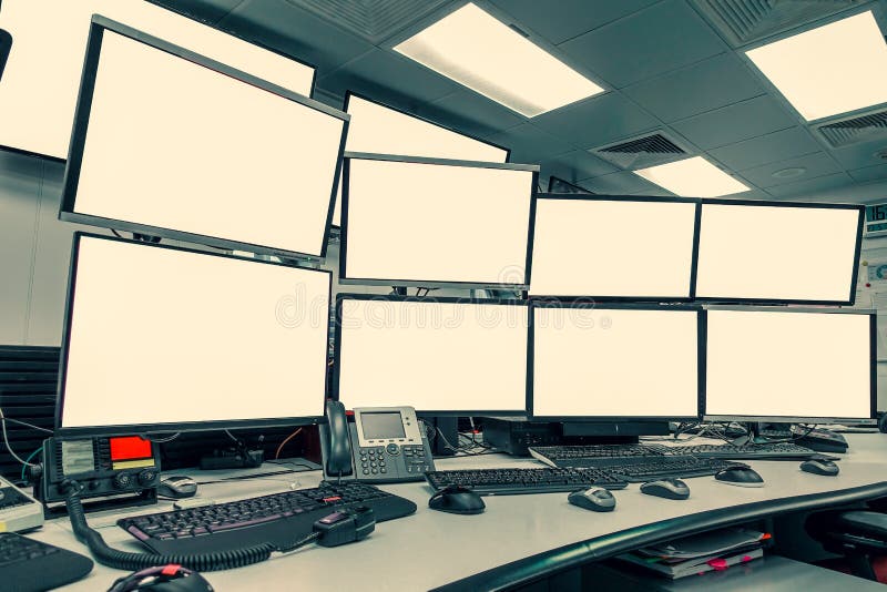 Group of Blank Monitors and Screen on Security Desk or Control Room for ...