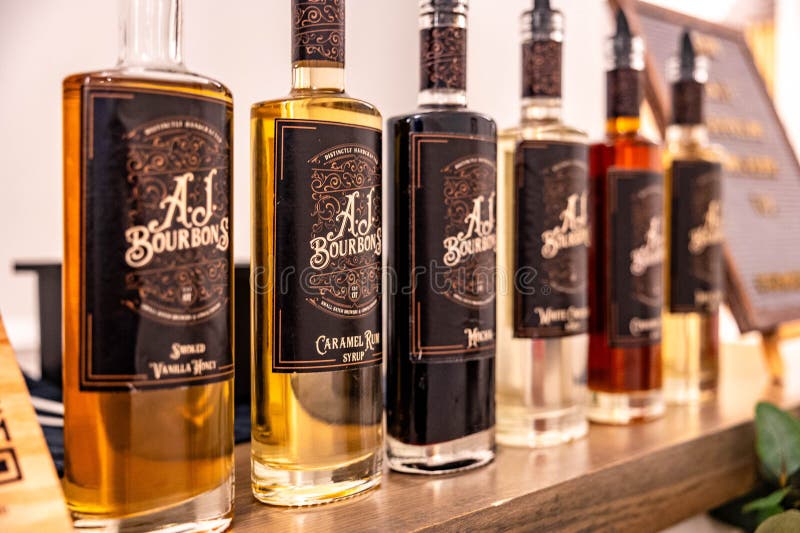 A Group of Bottles of Various Types of Alcohol on a Shelf Editorial ...