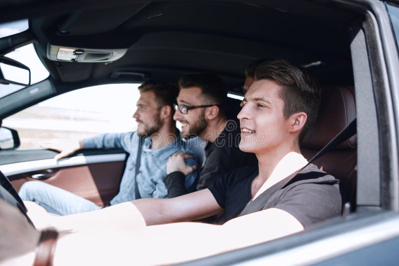 A Group of Boys Rides and Looks Directly at the Car Stock Image - Image ...