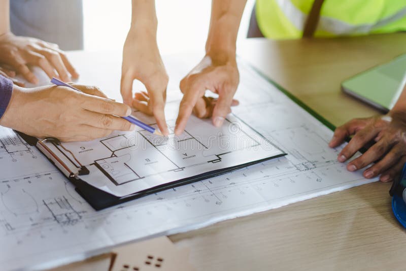 Group of Builder Team Planning and Discussing Construction Home Drawing ...