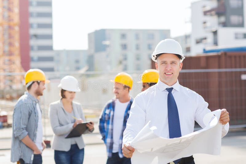 Group of Builders with Tablet Pc and Blueprint Stock Image - Image of ...