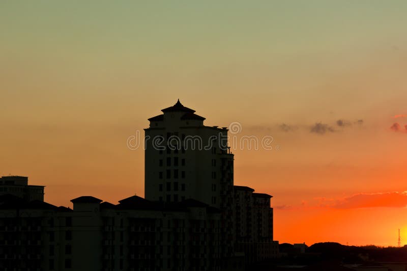 Group of Buildings in Silhouette, at a Tropical Sunset Stock Photo ...