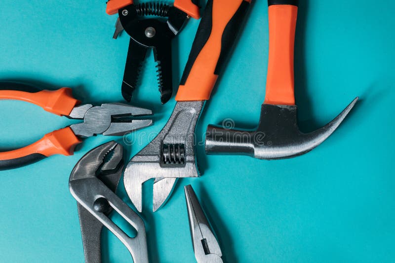 Group a Bunch of Tools with Orange Handles on a Blue Background Laid ...