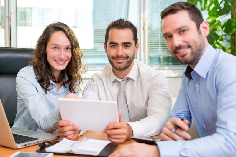 Group Of Business Associates Working Together At The Office Stock Photo ... Group Of Business Associates Working Together At The Office Stock Photo ...