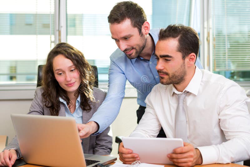 Group of Business Associates Working Together at the Office Stock Image ...