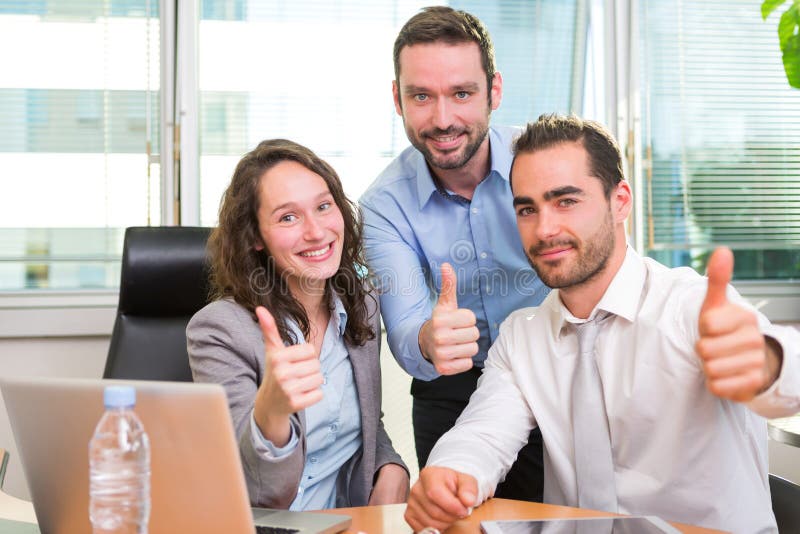 Group Of Business Associates Working Together At The Office Stock Photo ... Group Of Business Associates Working Together At The Office Stock Photo ...