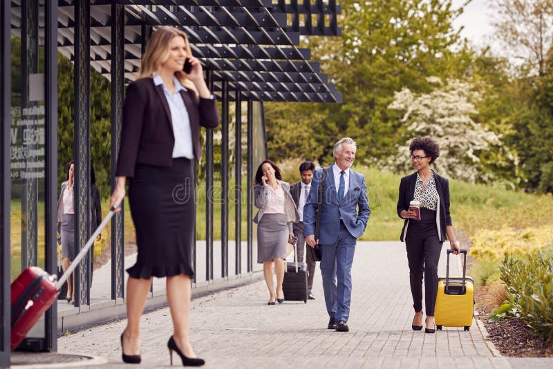 Group of Business Delegates with Luggage Arriving at Conference Hotel ...