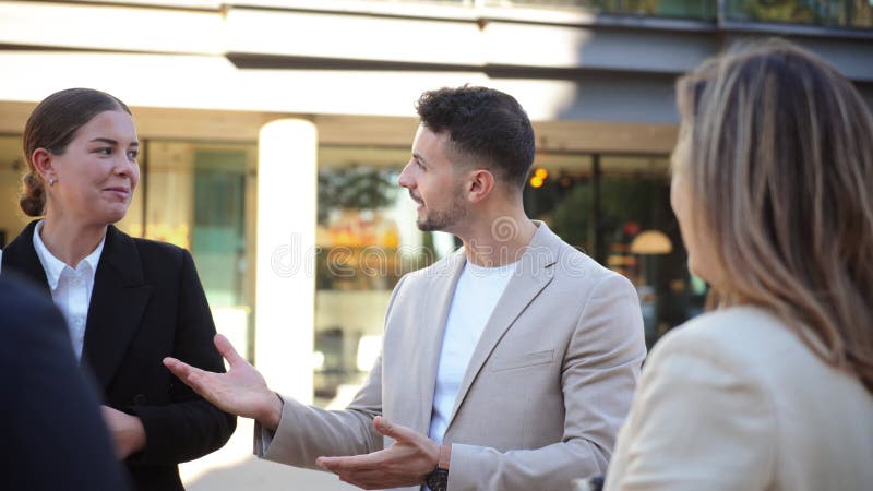 Business Professionals Engaged in Meaningful Discussion while Making a ...