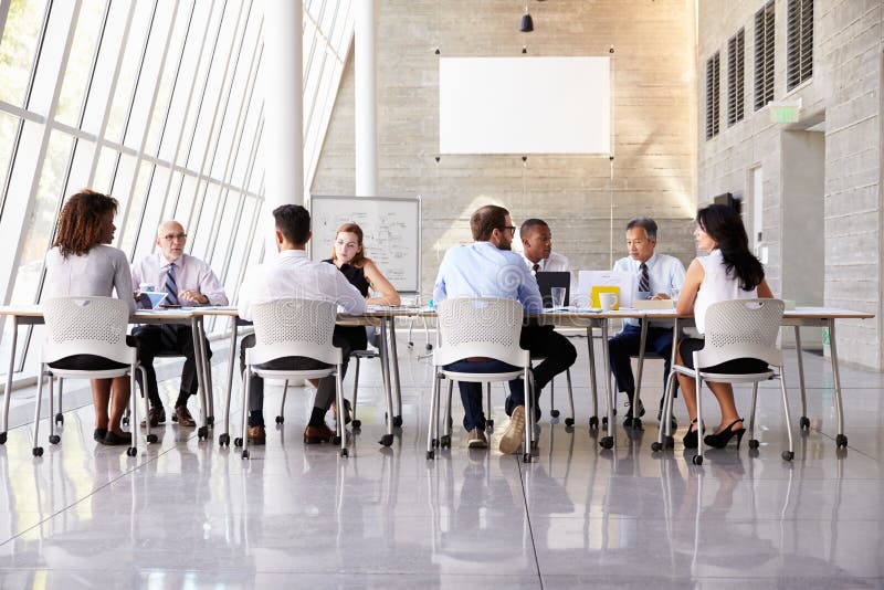 Group Business Meeting Around Table in Modern Office Stock Photo ...
