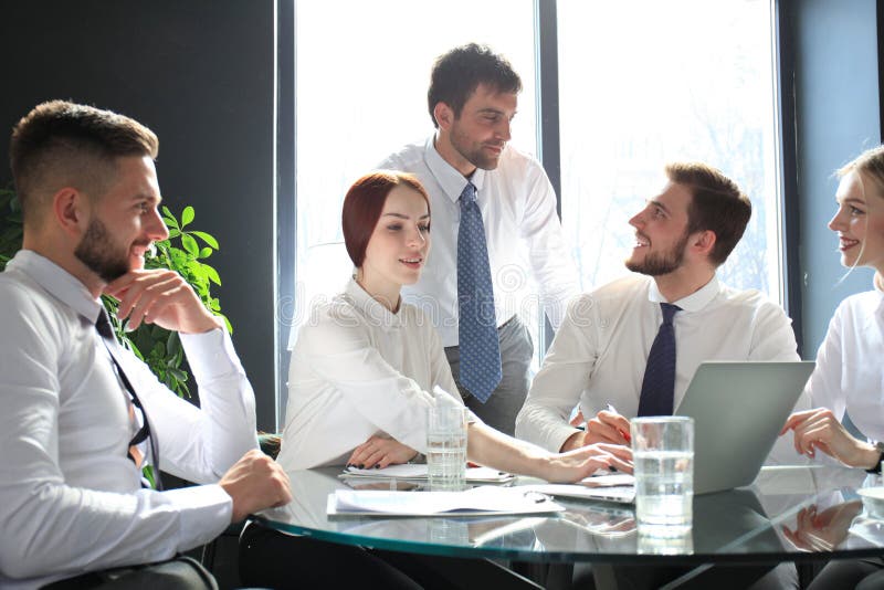 Group of Business Partners Discussing Ideas and Planning Work in Office ...