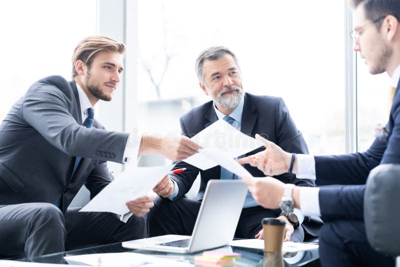 Group of Business Partners Discussing Ideas and Planning Work in Office ...