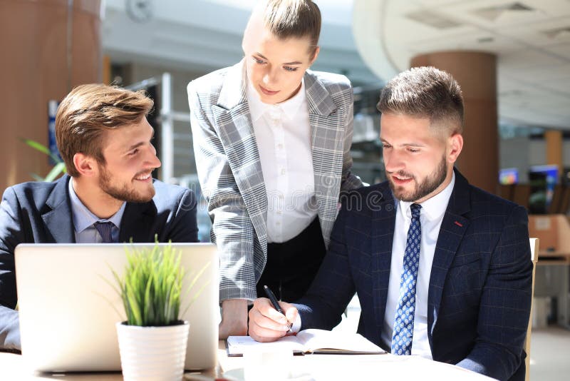 Group of Business Partners Discussing Ideas and Planning Work in Office ...