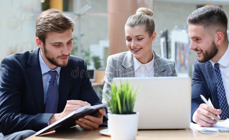 Group of Business Partners Discussing Ideas and Planning Work in Office ...