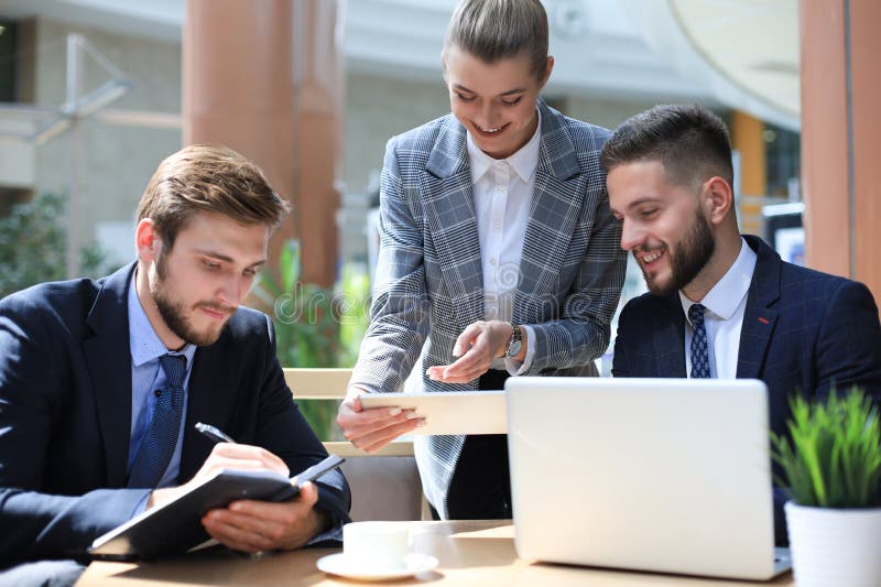 Group of Business Partners Discussing Ideas and Planning Work in Office ...