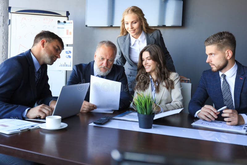 Group of Business Partners Discussing Ideas and Planning Work in Office ...