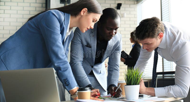 Group of Business Partners Discussing Ideas and Planning Work in Office ...
