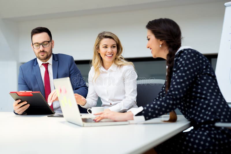 Group of Business Partners Discussing Ideas and Planning Work in Office ...