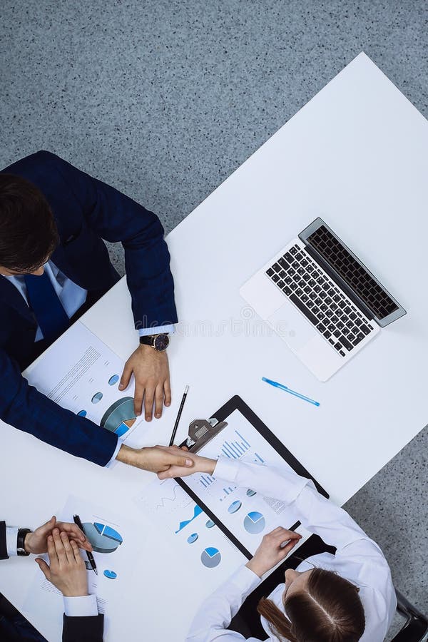 Group of Business People Analyzing Financial Documents, View from Above ... Group of Business People Analyzing Financial Documents, View from Above ...