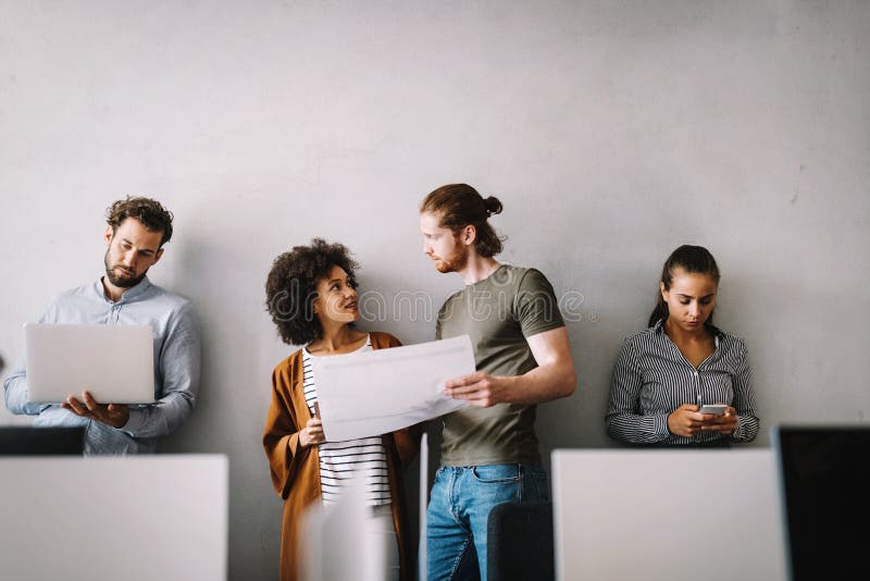 Group of Business People Collaborating on Project in Office Stock Photo ...