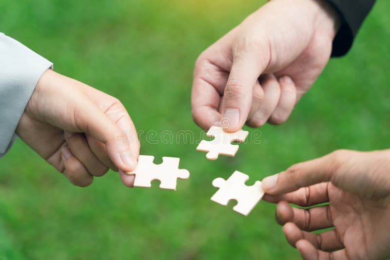 Group of Business People Assembling Jigsaw Puzzle. the Concept of ...