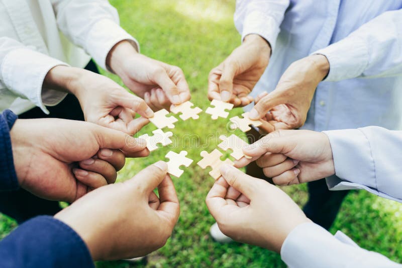 Group of Business People Assembling Jigsaw Puzzle. the Concept of ...
