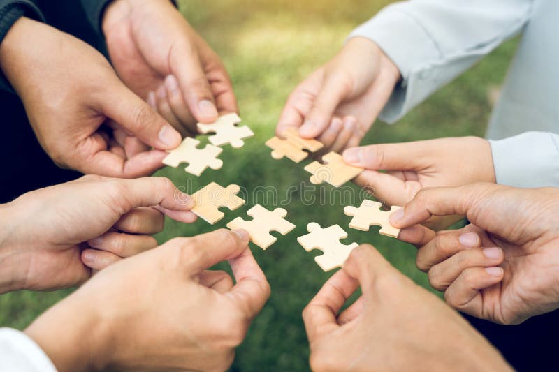 Group of Business People Assembling Jigsaw Puzzle. the Concept of ...