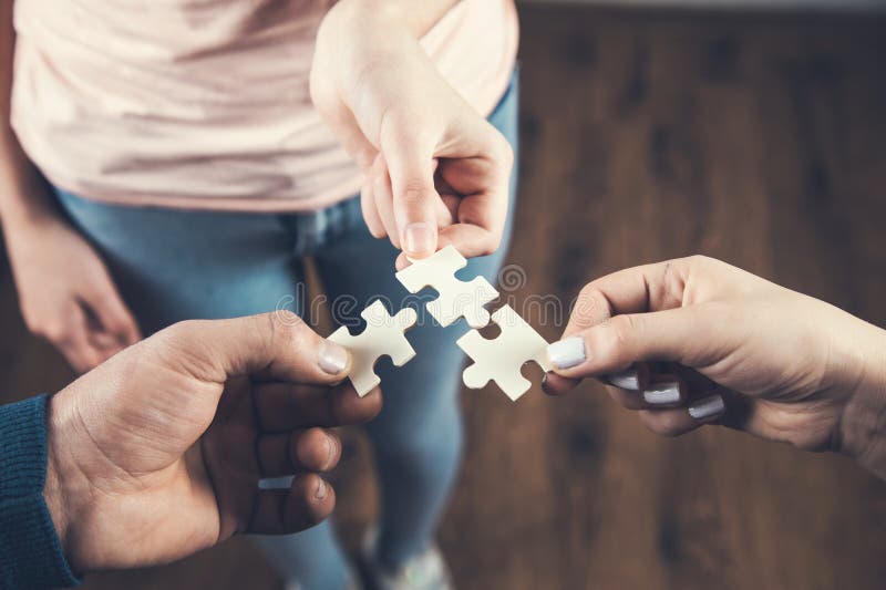 A Group of Business People Assembling Puzzle Stock Photo - Image of ...