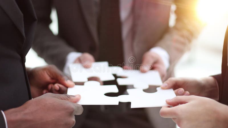 Group of Business People Assembling Jigsaw Puzzle and Represent Team ...