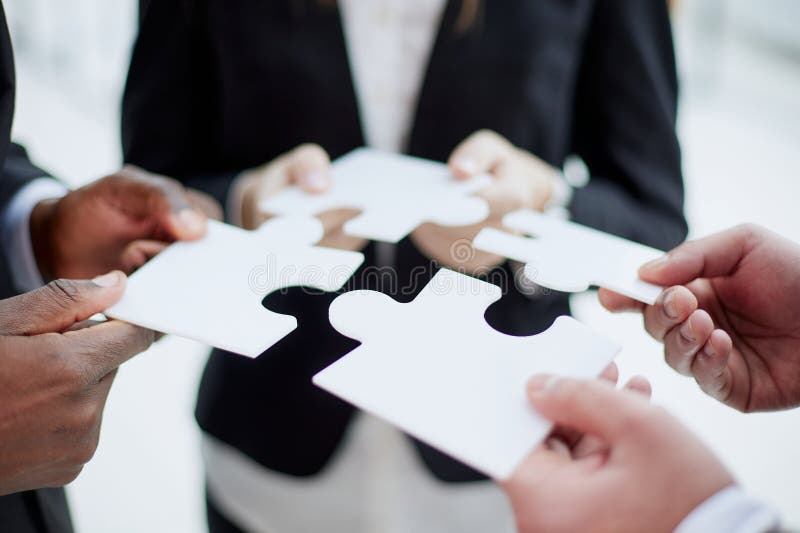Group of Business People Assembling Jigsaw Puzzle and Represent Team ...