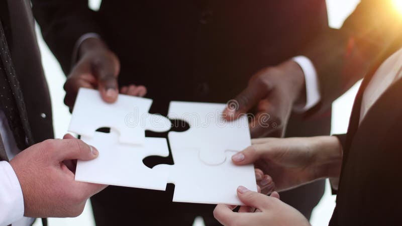 Group of Business People Assembling Jigsaw Puzzle and Represent Team ...