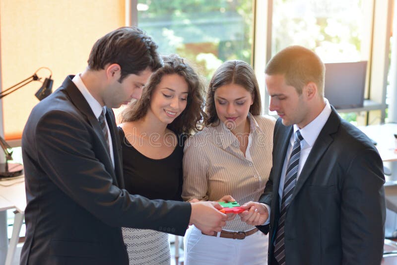 Group of Business People Assembling Jigsaw Puzzle and Represent Stock ...