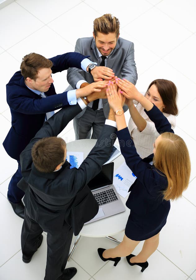 Group of Business People Celebrating Their Teamwork with a High Stock ...