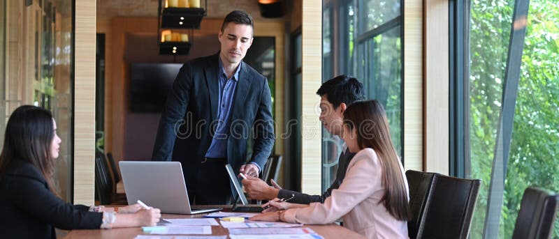 Group of Business People Collaborating on New Project in Office. Stock ...