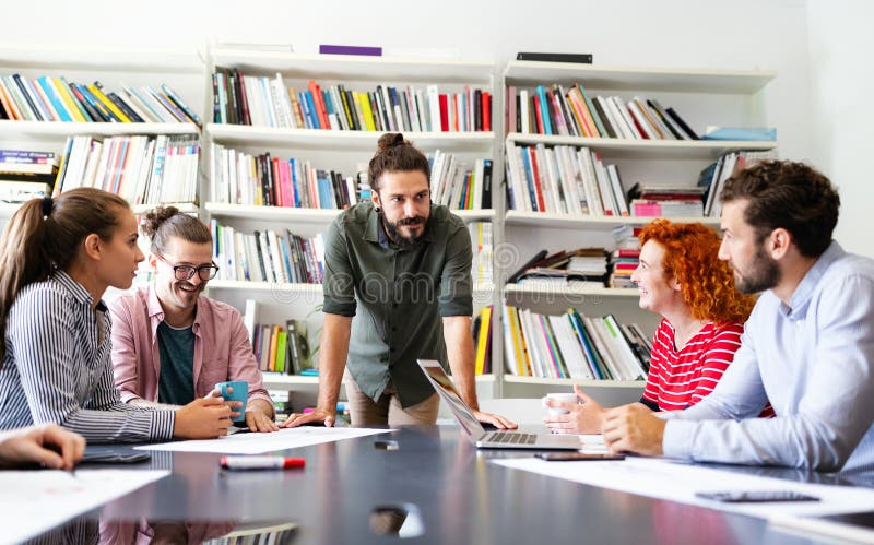 Group of Business People Collaborating on Project in Office Stock Photo ...