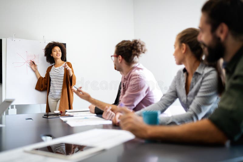 Group of Business People Collaborating on Project in Office Stock Photo ...