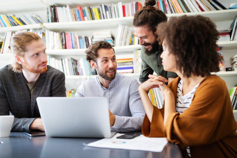 Group of Business People Collaborating on Project in Office Stock Photo ...