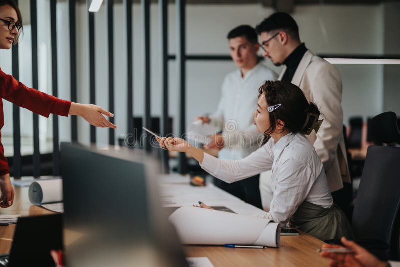 Group of Business People Collaborating on a Project at Office Stock ...