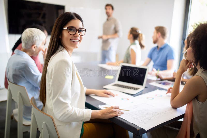 Group of Business People Collaborating on Project in Office Stock Photo ...