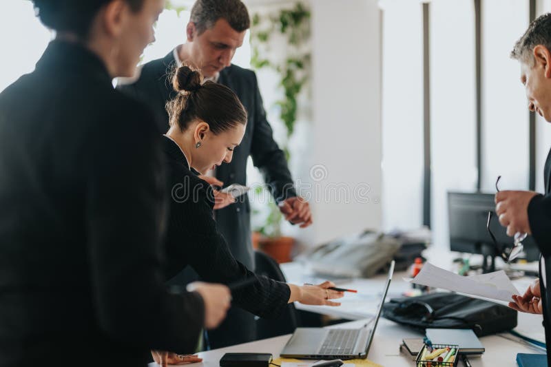 Group of Business People Collaborating on a Project in an Office ...