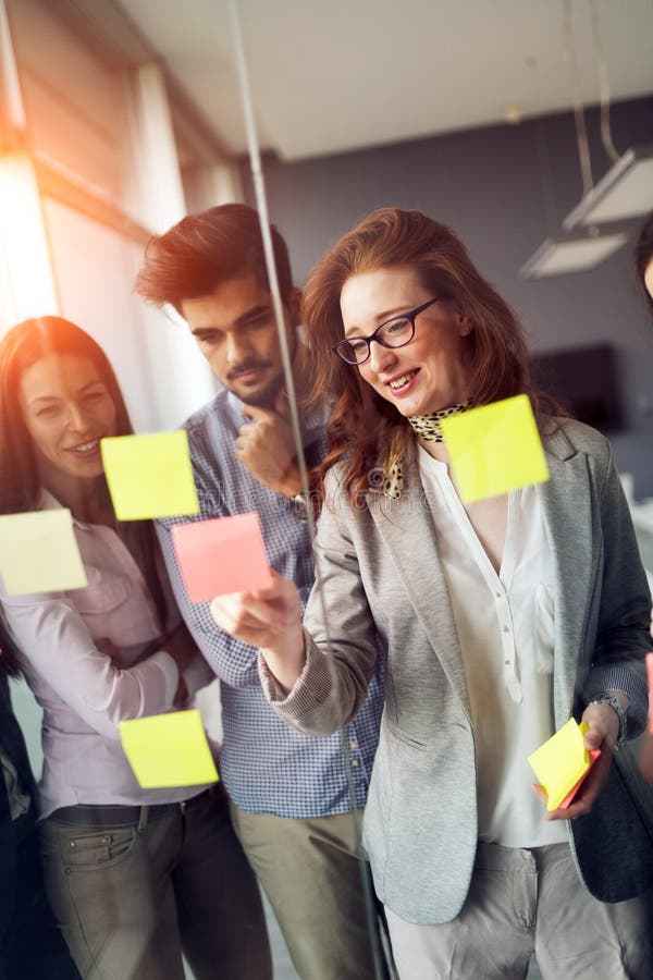 Group of Business People Collaborating and Working on Project Stock ...