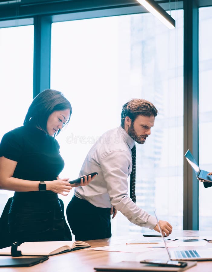 Group of Business People Communicating and Working at Table Stock Image ...