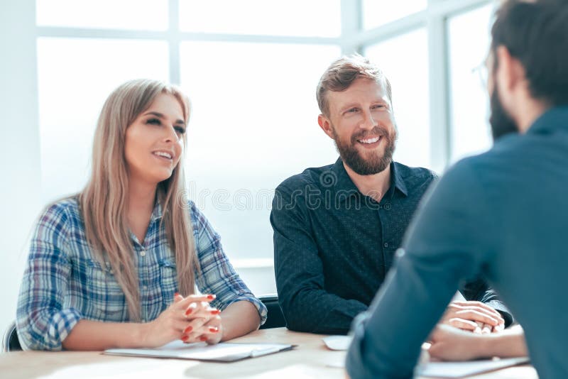 Group of Business People Conducting an Interview Sitting at the Table ...