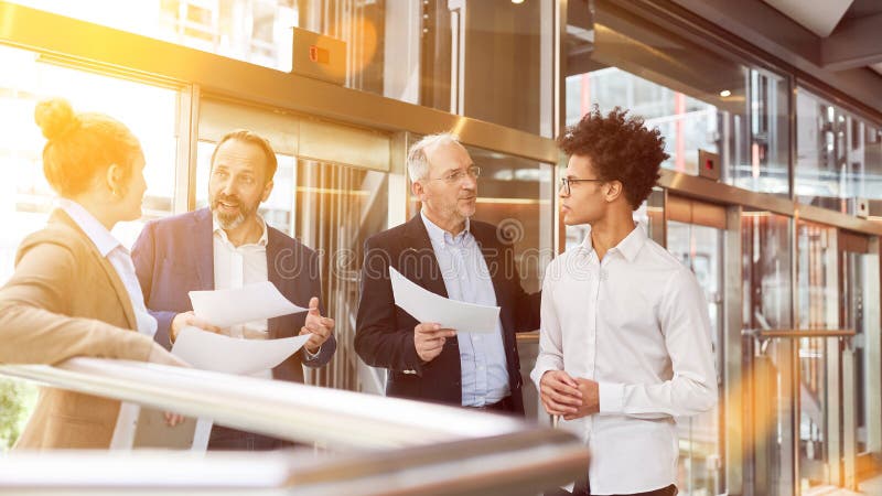 Group of Business People in Consultation and Cooperation Stock Photo ...